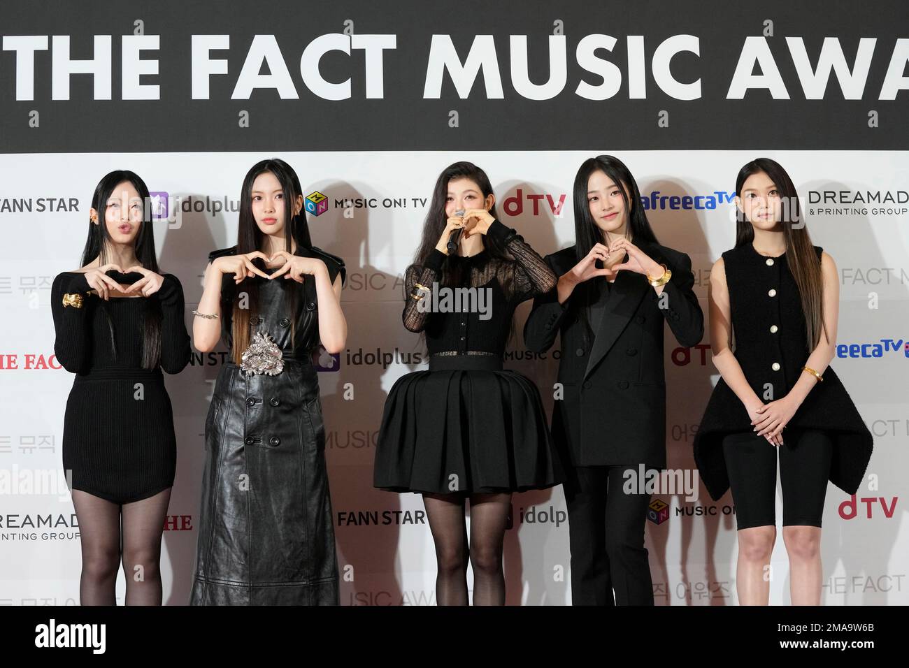 K-Pop girl group NewJeans pose for photos during the red carpet of 2022 The Fact Music Awards in ...
