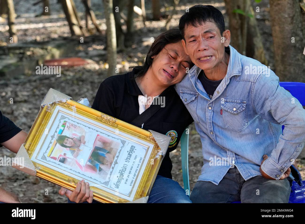 Tukta Wongsila grieves with her father Saart as holds her daughter Siriprapa “Plai Fon ...