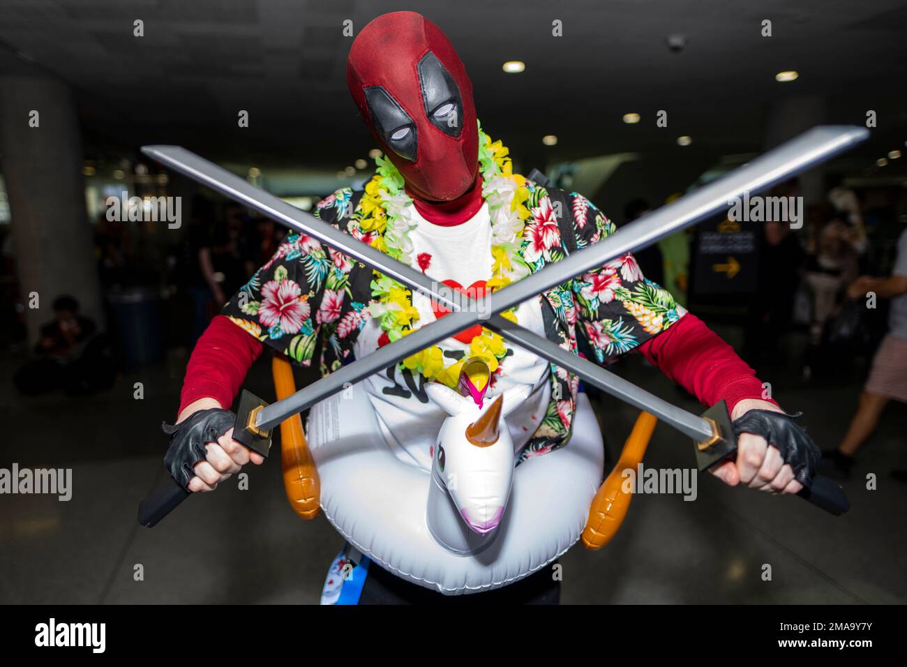An attendee dressed as Deadpool poses during New York Comic Con at the ...