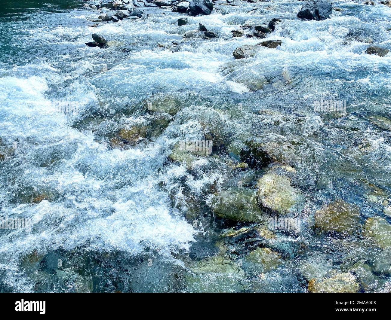 A high angle shot of splashing water in a rocky river Stock Photo - Alamy