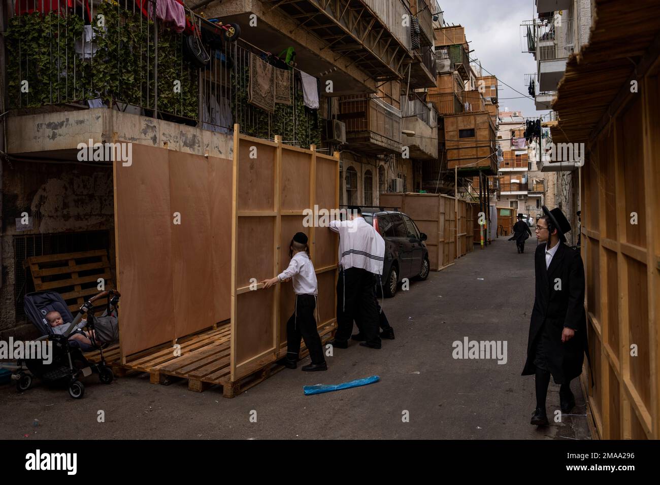Ultra-orthodox Jews build a Sukkah, a temporary structure built for the ...