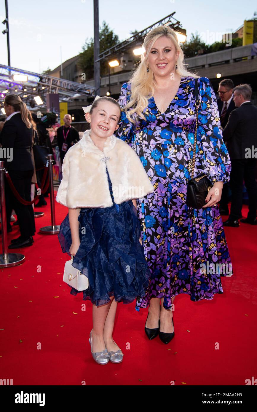 Darcy Pentland and Louise Pentland pose for photographers upon arrival ...