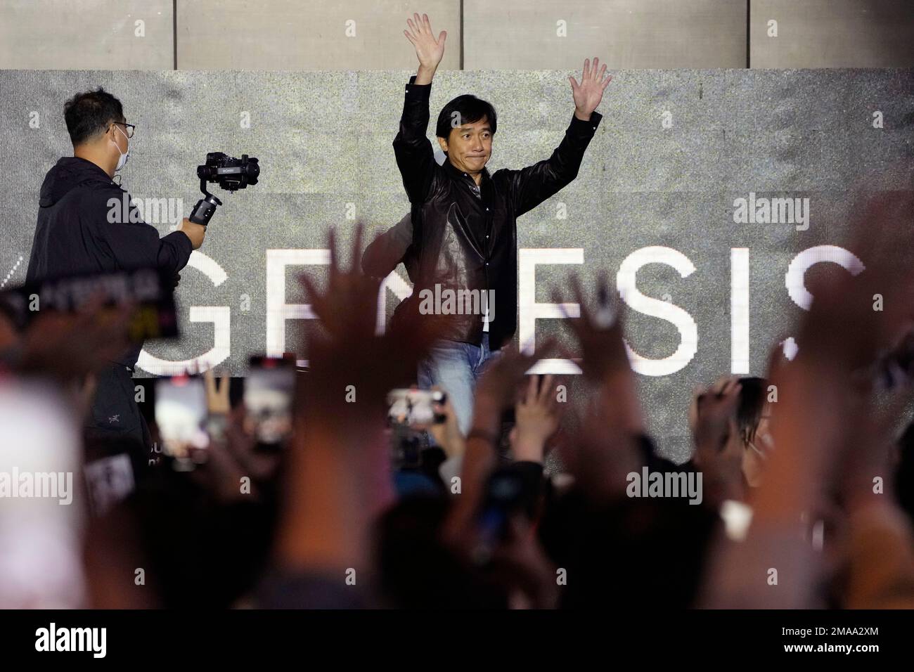 Hong Kong actor Tony Leung Chiu-wai waves after an open talk at the 27th Busan International ...