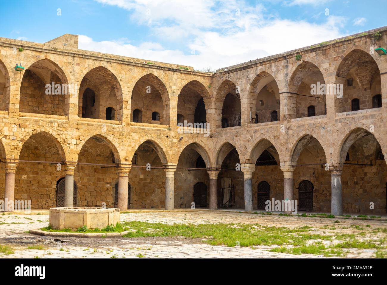 Medieval square building with a courtyard and many arches Stock Photo ...