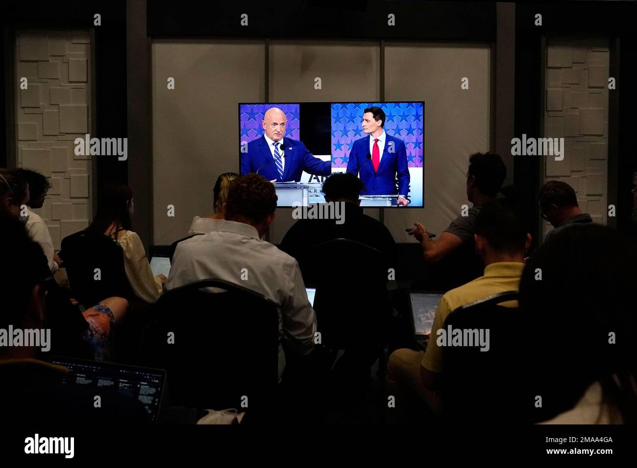 Members of the media watch Arizona Democratic Sen. Mark Kelly, left ...