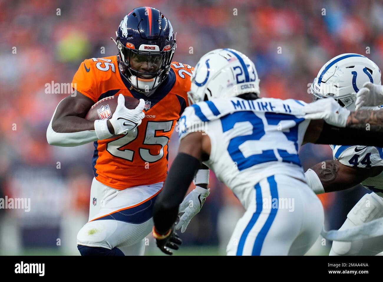 Denver Broncos running back Melvin Gordon III (25) runs as Indianapolis ...