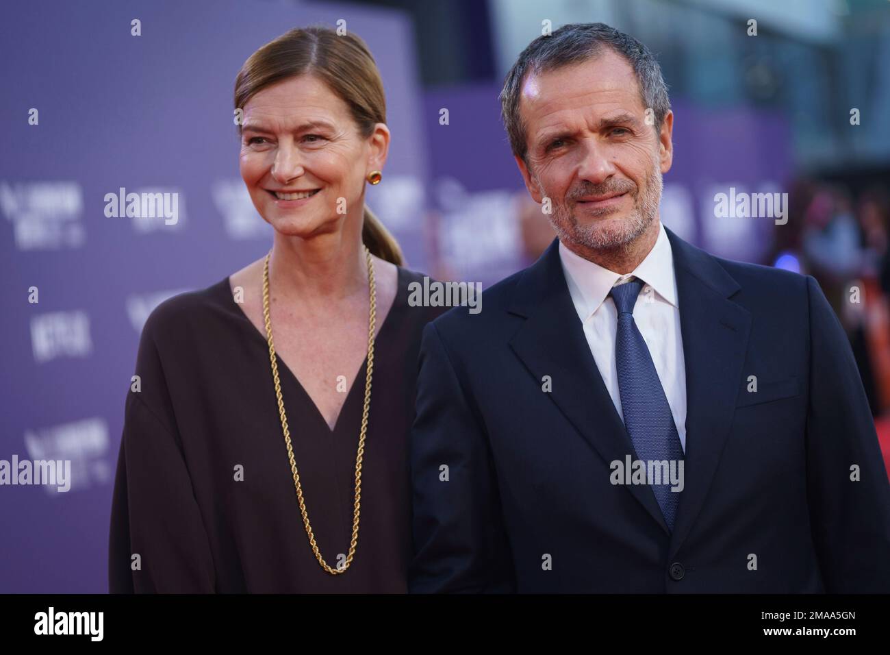 Rose Uniacke, left, and producer David Heyman pose for photographers ...