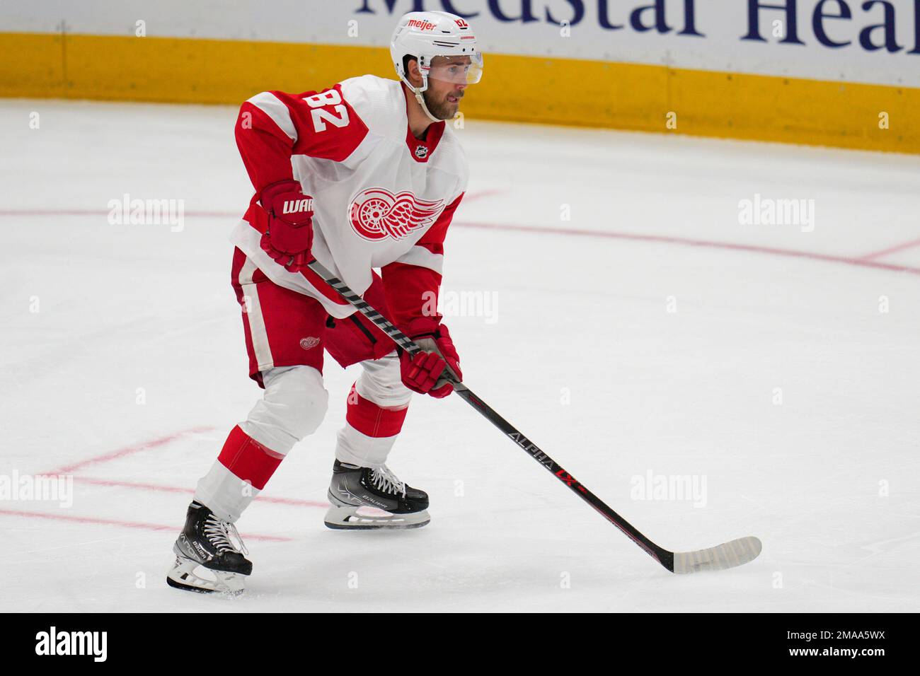 Detroit Red Wings defenseman Jordan Oesterle (82) defends against the ...