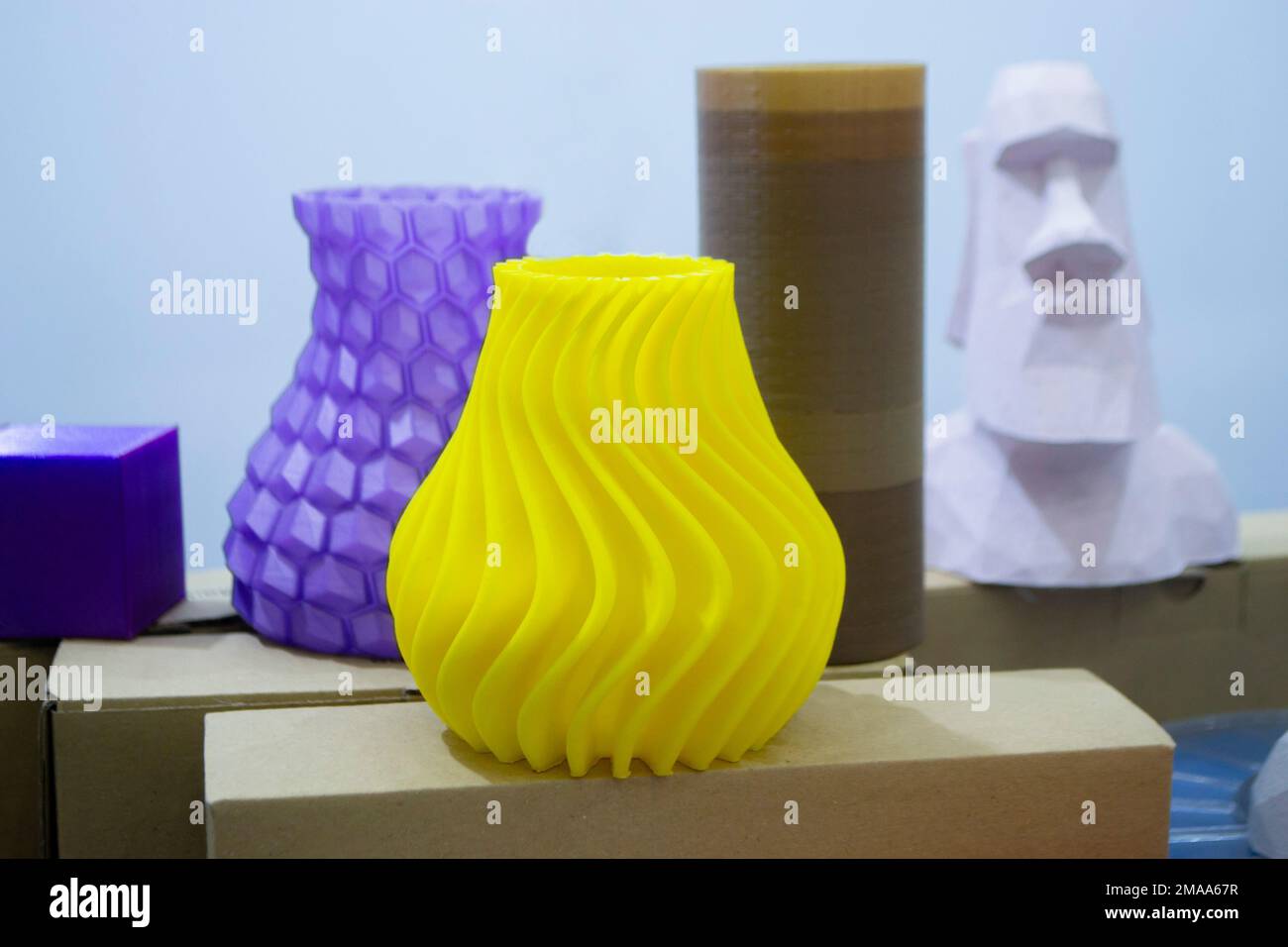 Several different abstract multi-color models printed on a 3D printer ...