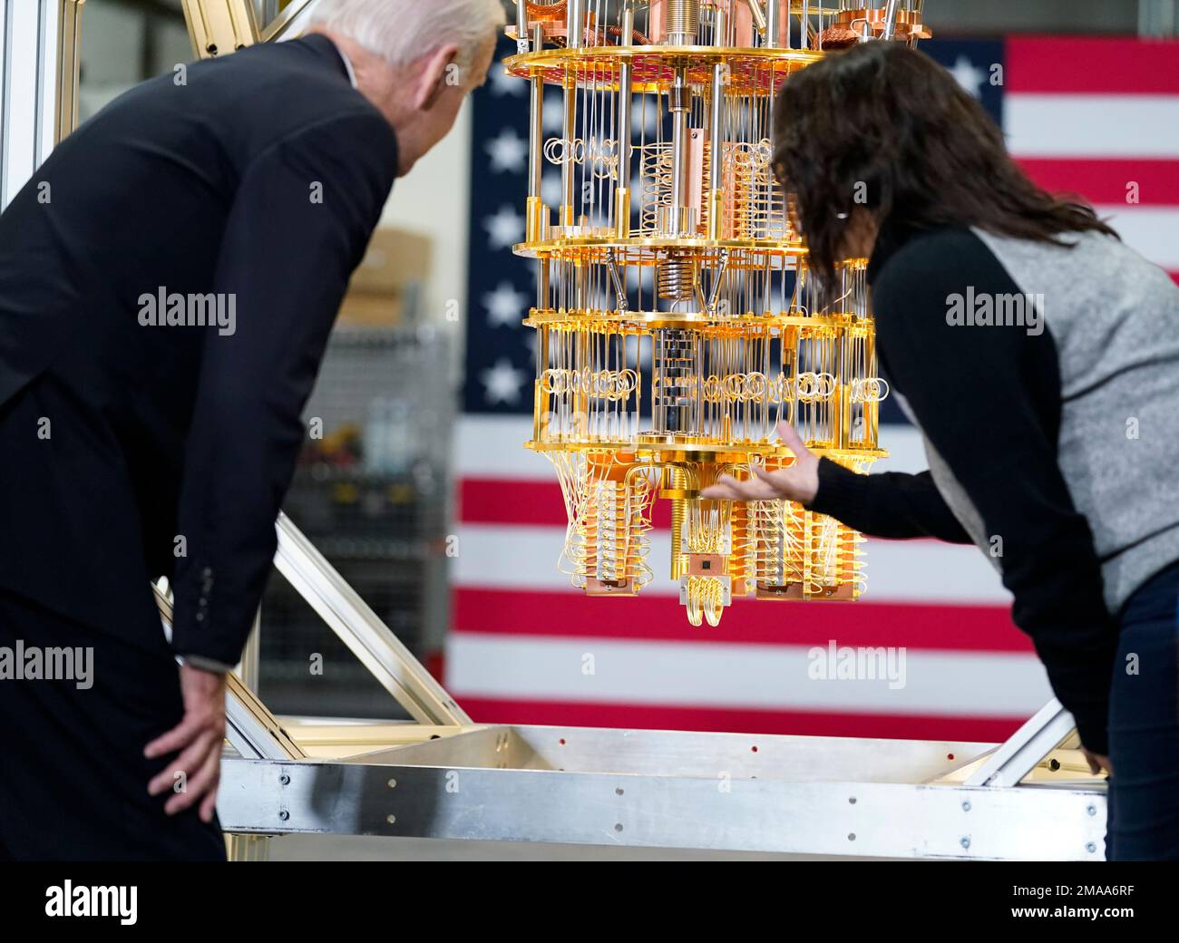 President Joe Biden looks at the IBM System One quantum computer during ...