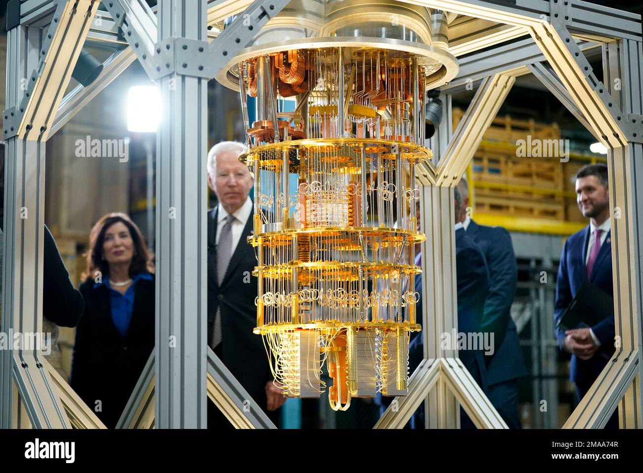 President Joe Biden looks at the IBM System One quantum computer with ...