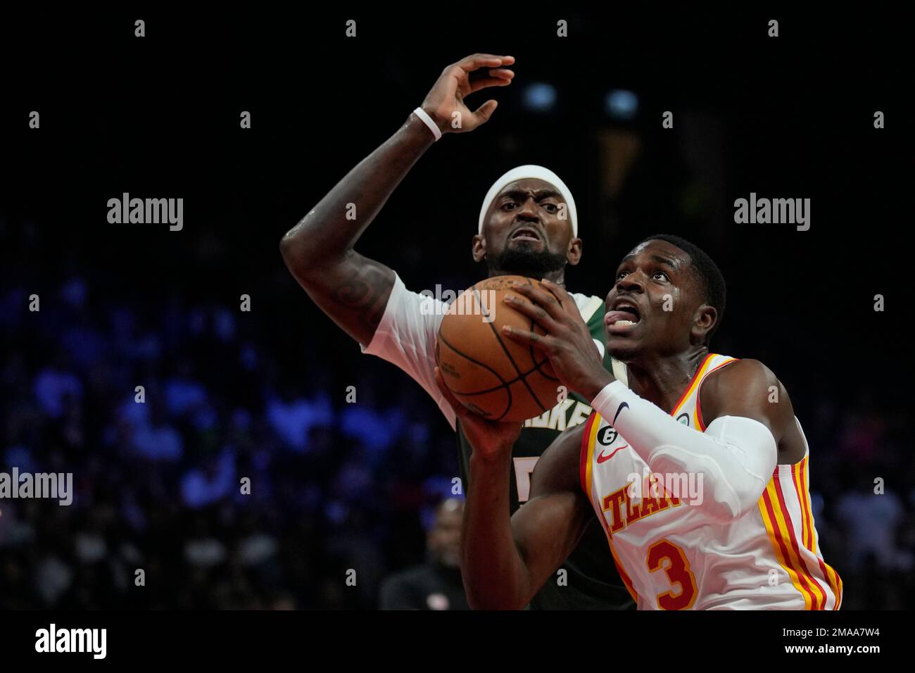 Aaron Holiday of Atlanta Hawks in action by Bobby Portis of Milwaukee ...