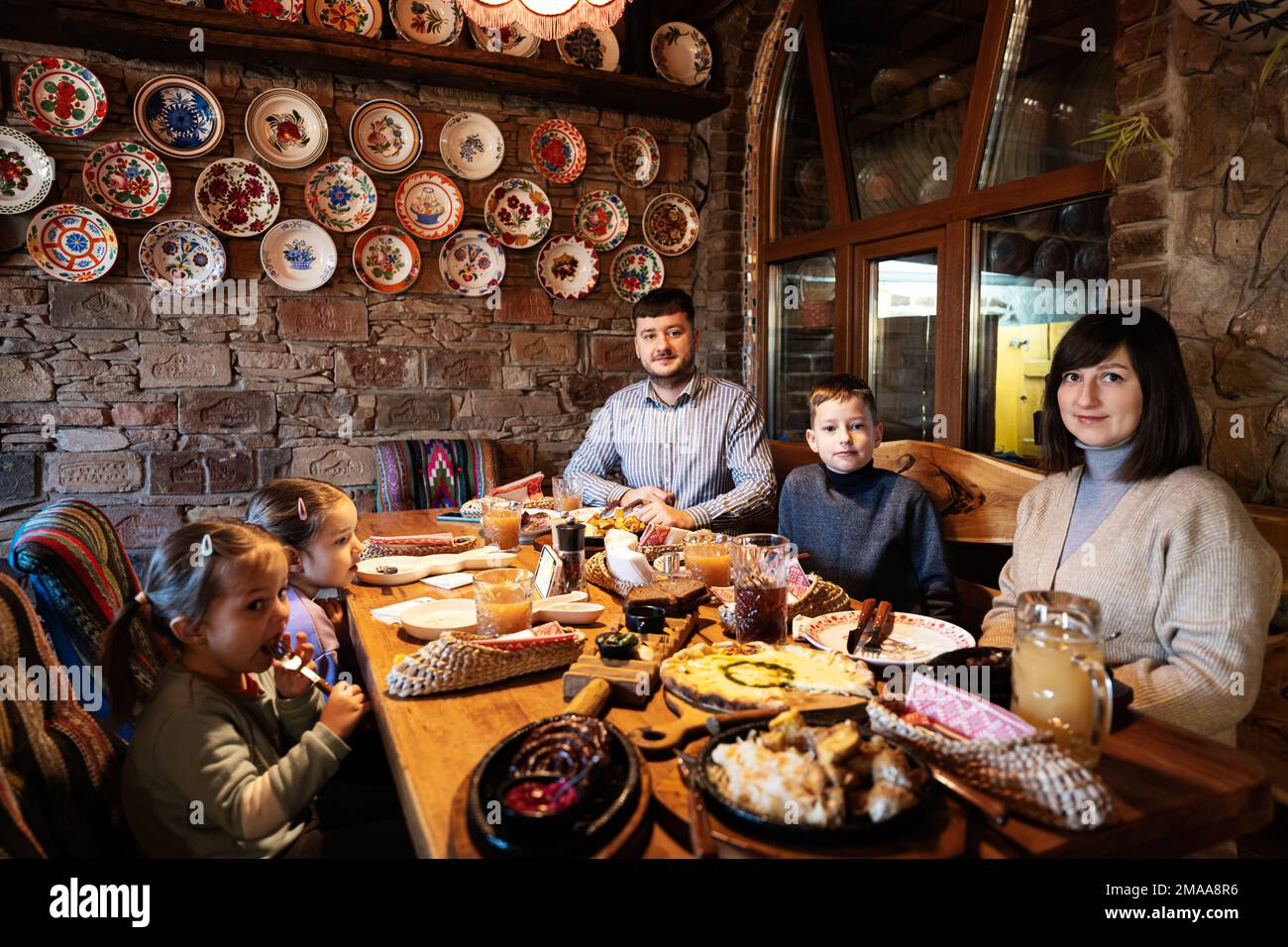 Family having a meal together in authentic ukrainian restaurant Stock ...