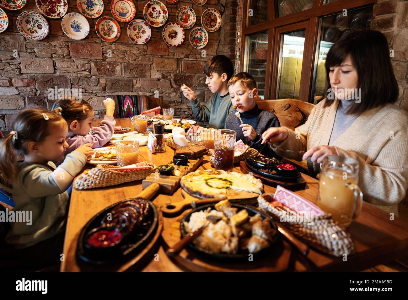 Family having a meal together in authentic ukrainian restaurant Stock ...