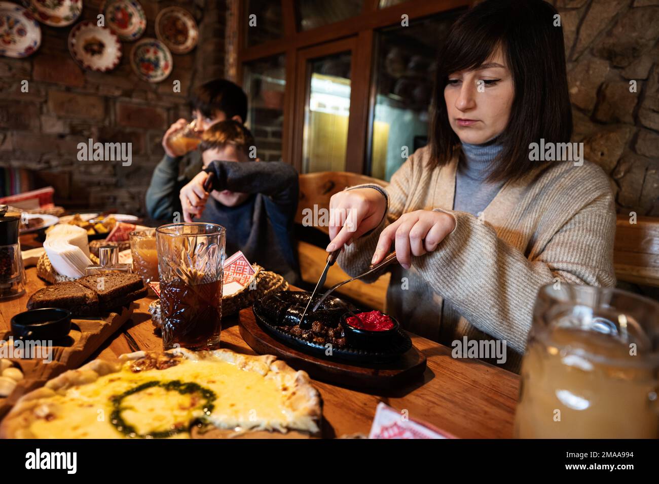 Family having a meal together in authentic ukrainian restaurant Stock ...
