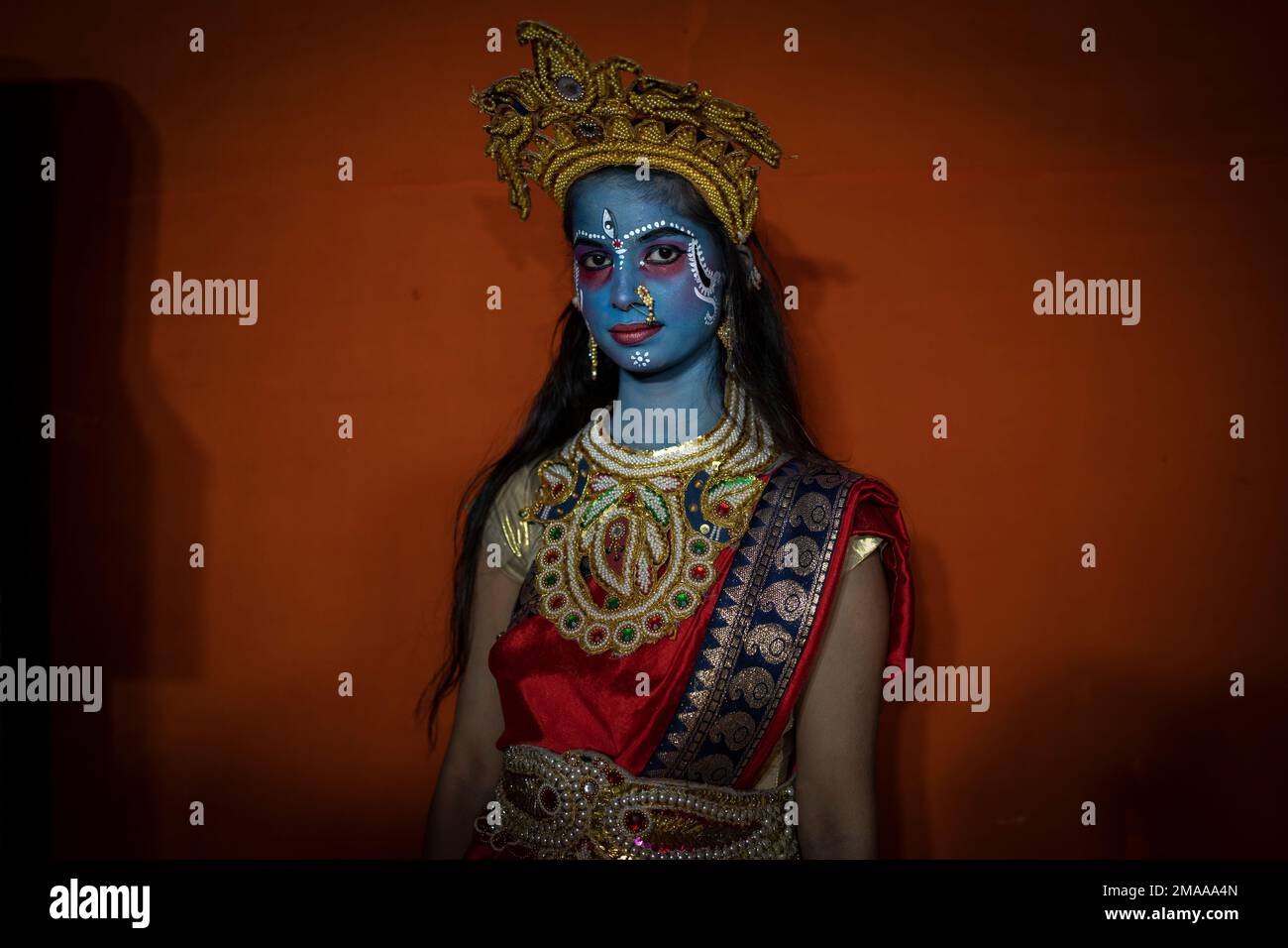 An artist poses before her Ramleela performance as part of Dussehra ...