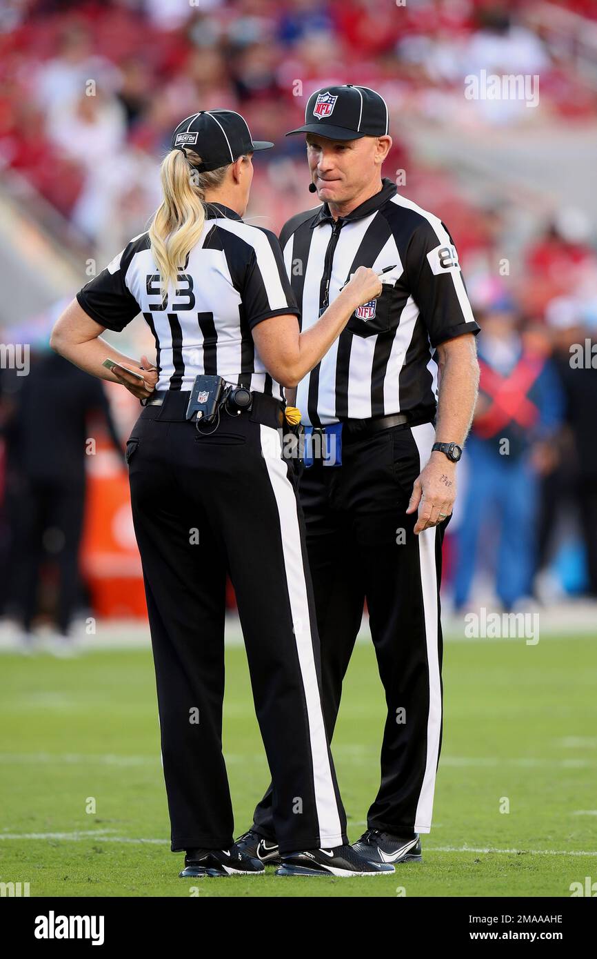 Down judge Sarah Thomas (53) and line judge Daniel Gallagher (85) talk ...