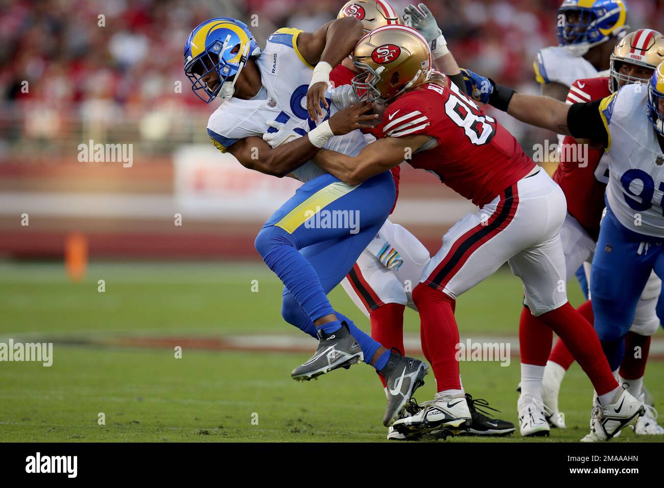 Los Angeles Rams linebacker Justin Hollins (58) fights off a block from ...