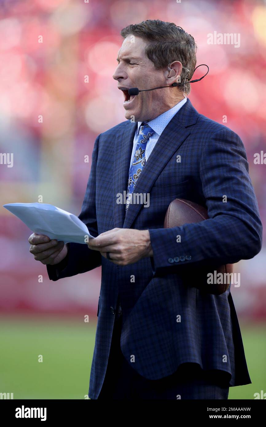 TV Analyst Steve Young reacts before an NFL football game between the San Francisco 49ers and ...