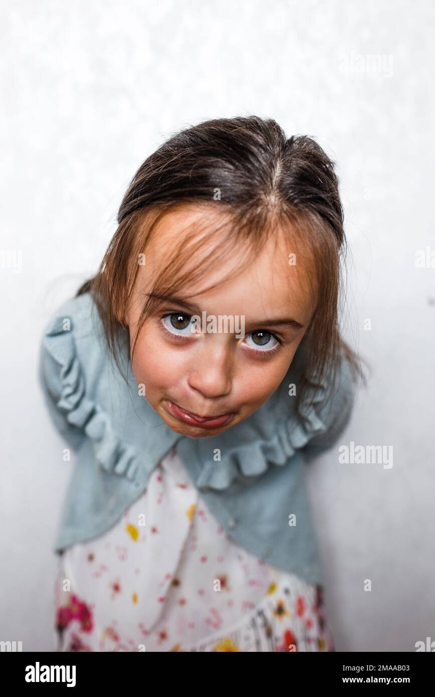 Photo portrait of a little girl, grimacing, fooling around, isolated ...