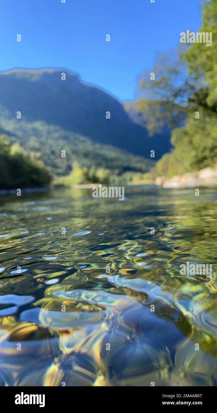 A vertical shot of lake water with sunlight reflection in Norway Stock ...