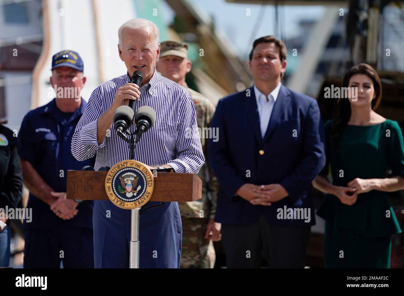 President Joe Biden speaks after touring an area impacted by Hurricane ...