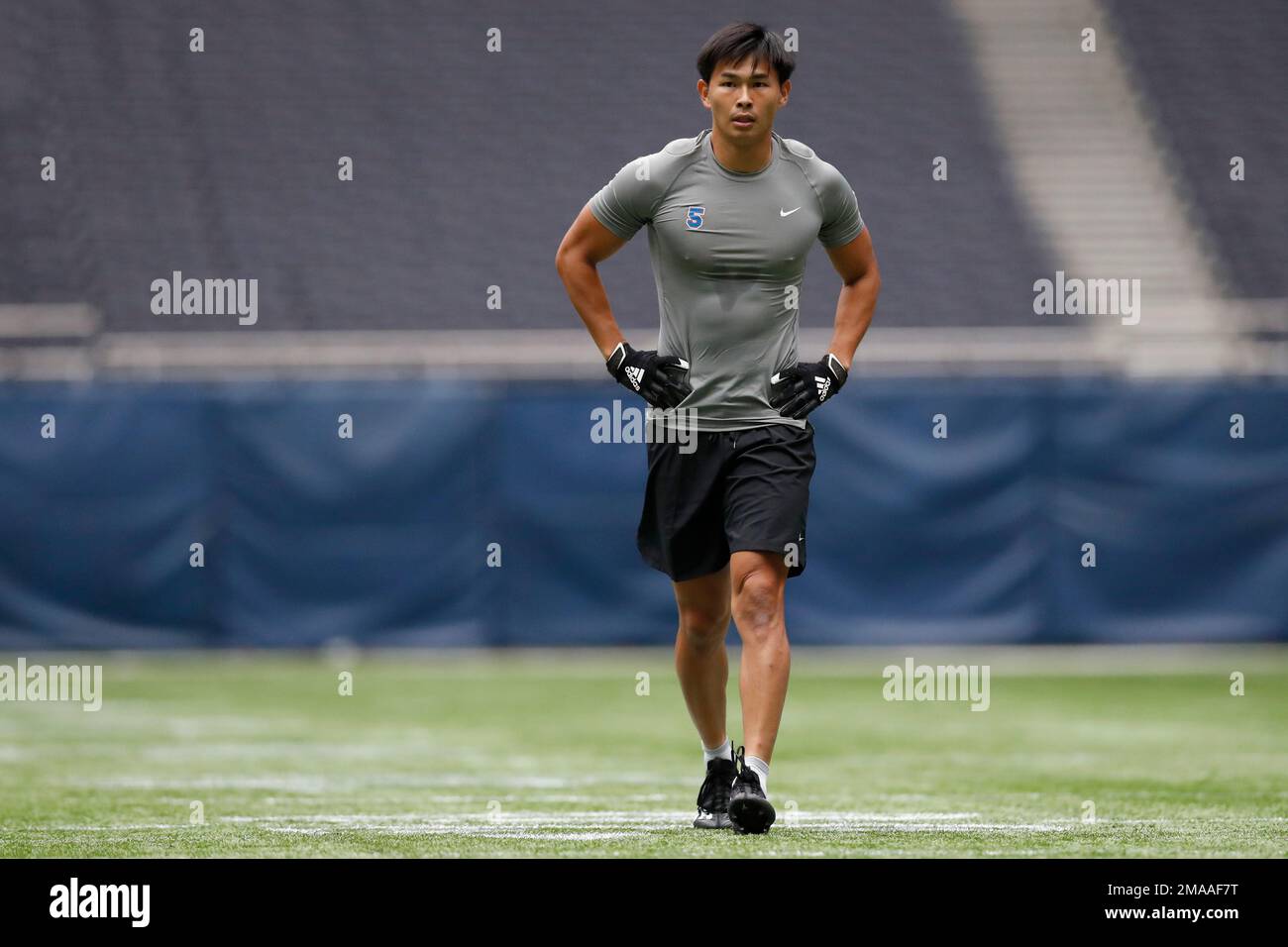 Wide receiver Riki Matsui, of Japan, participates in a drill at the NFL ...