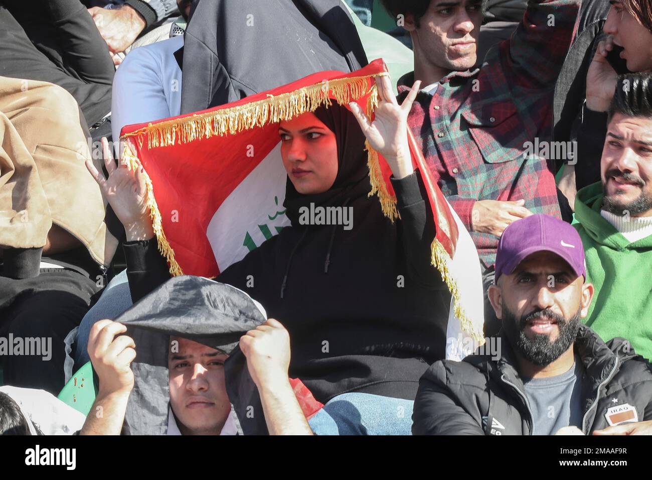 Iraqis fans wait inside the stadium before the Arabian Gulf Cup ...