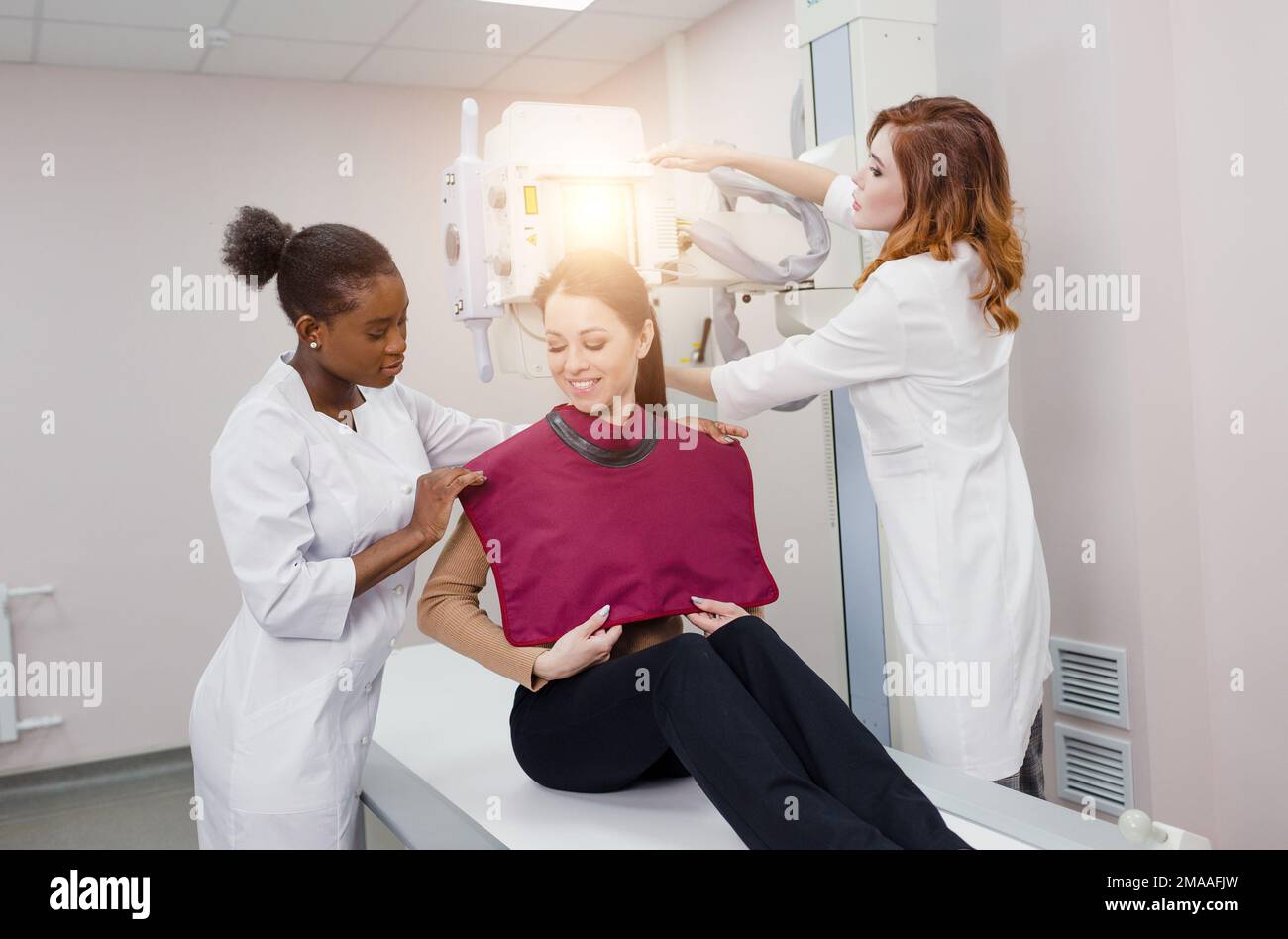 a female radiologist, together with an African-American assistant ...