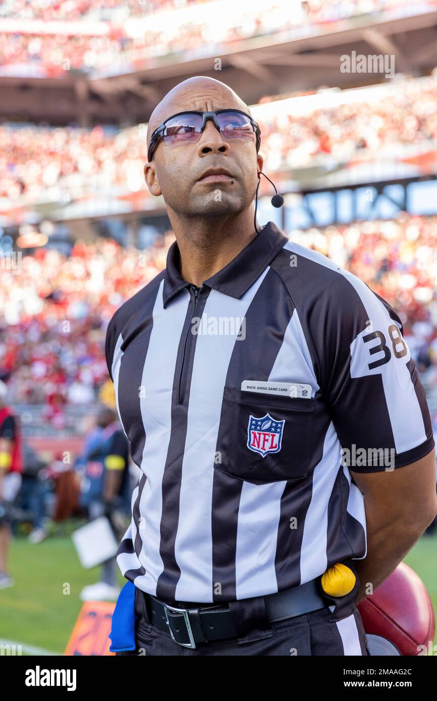 NFL official (38) Greg Yette stands for the National Anthem before ...