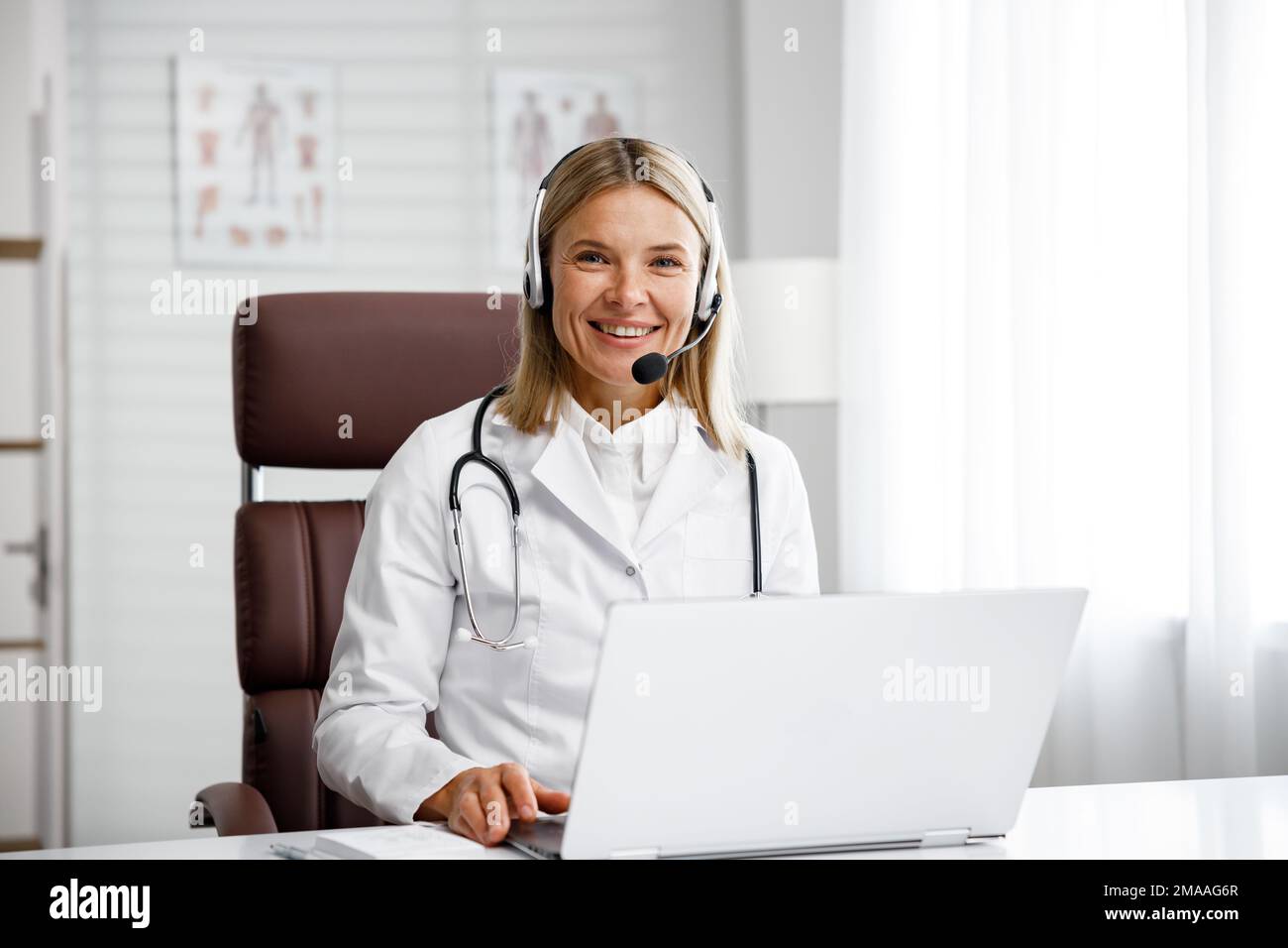 Telemedicine. Headshot portrait of smiling female doctor in headphones ...
