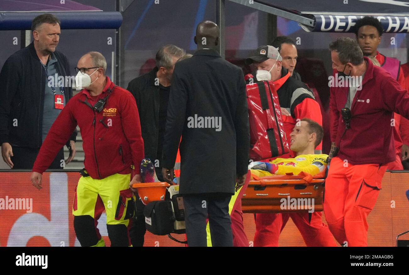 Medics carry Leipzig's goalkeeper Peter Gulacsi from the pitch during ...