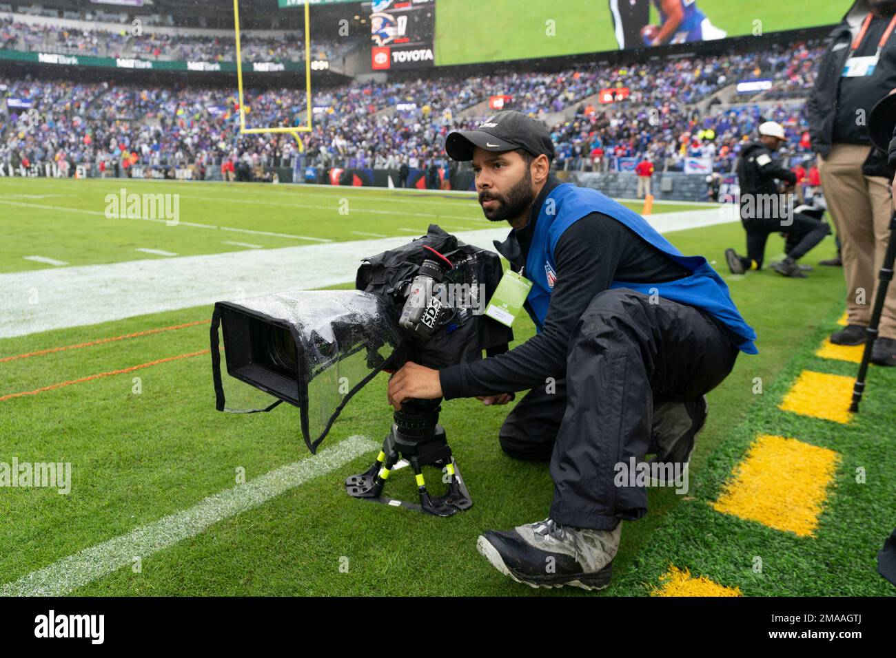 NFL Films camera operator Jeremy Nieves works during the first half of ...