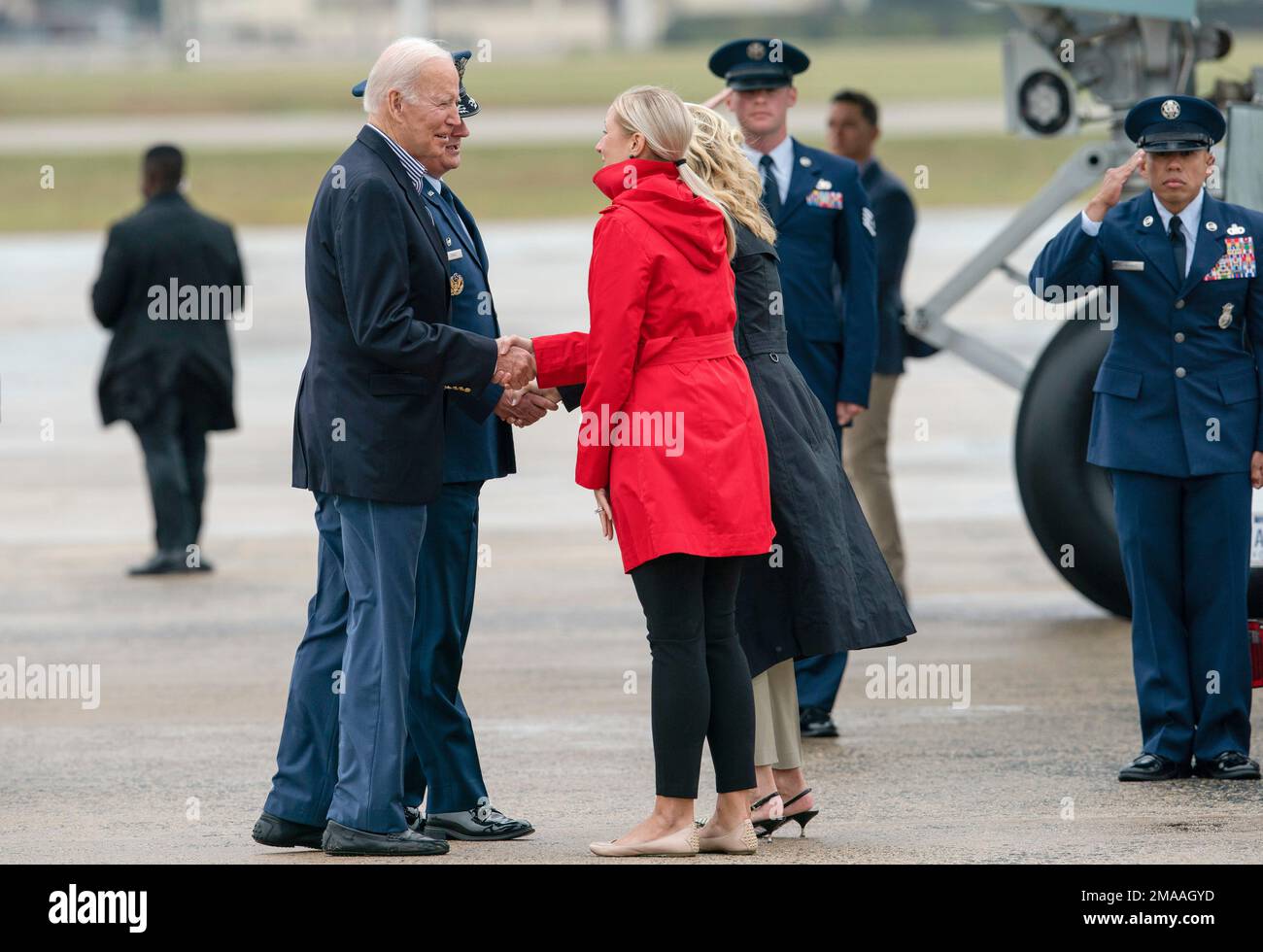 President Joe Biden shakes hands with Christie Jones, spouse of Col ...