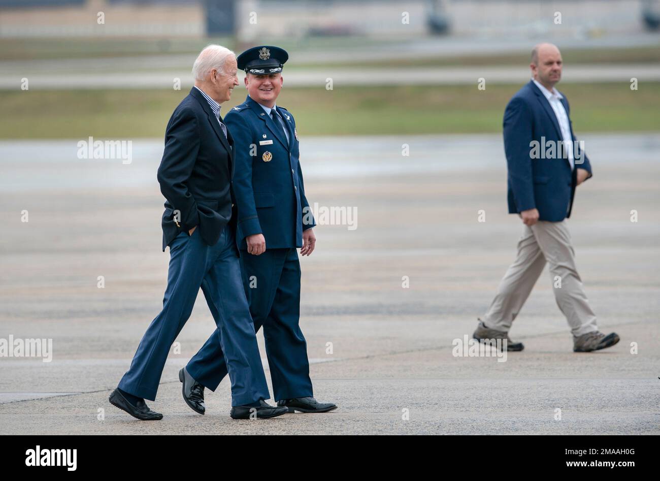 President Joe Biden escorted by Col. Matthew Jones, Commander of the ...