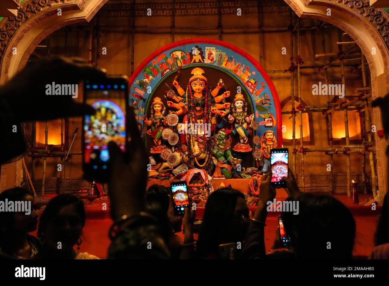 People crowd a makeshift worship place for Hindu goddess Durga during ...