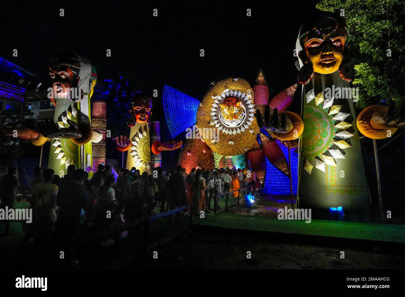 People crowd a makeshift worship place for Hindu goddess Durga during ...