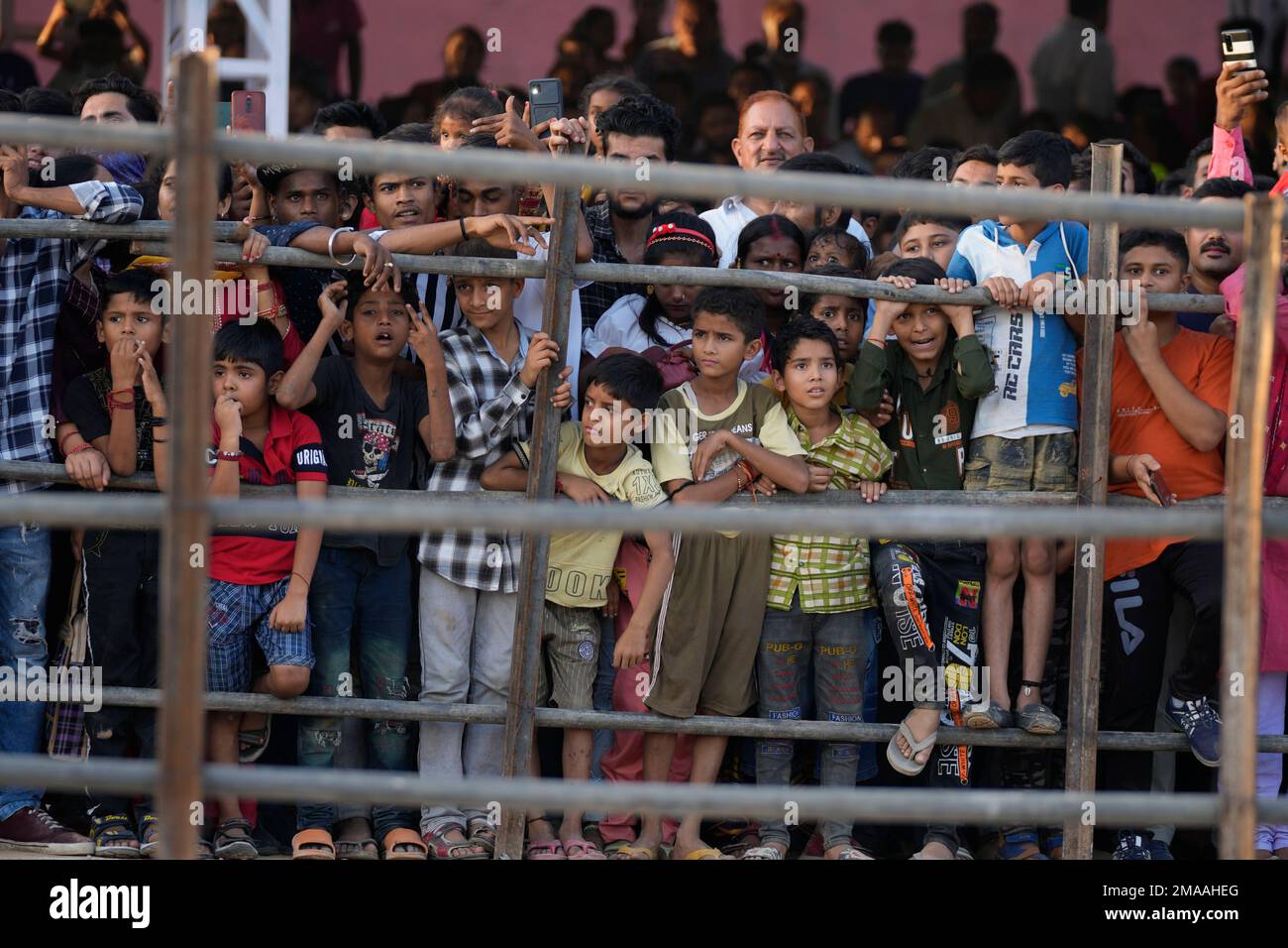 People watch a Dussehra procession in Jammu, India, Wednesday Oct. 5 ...