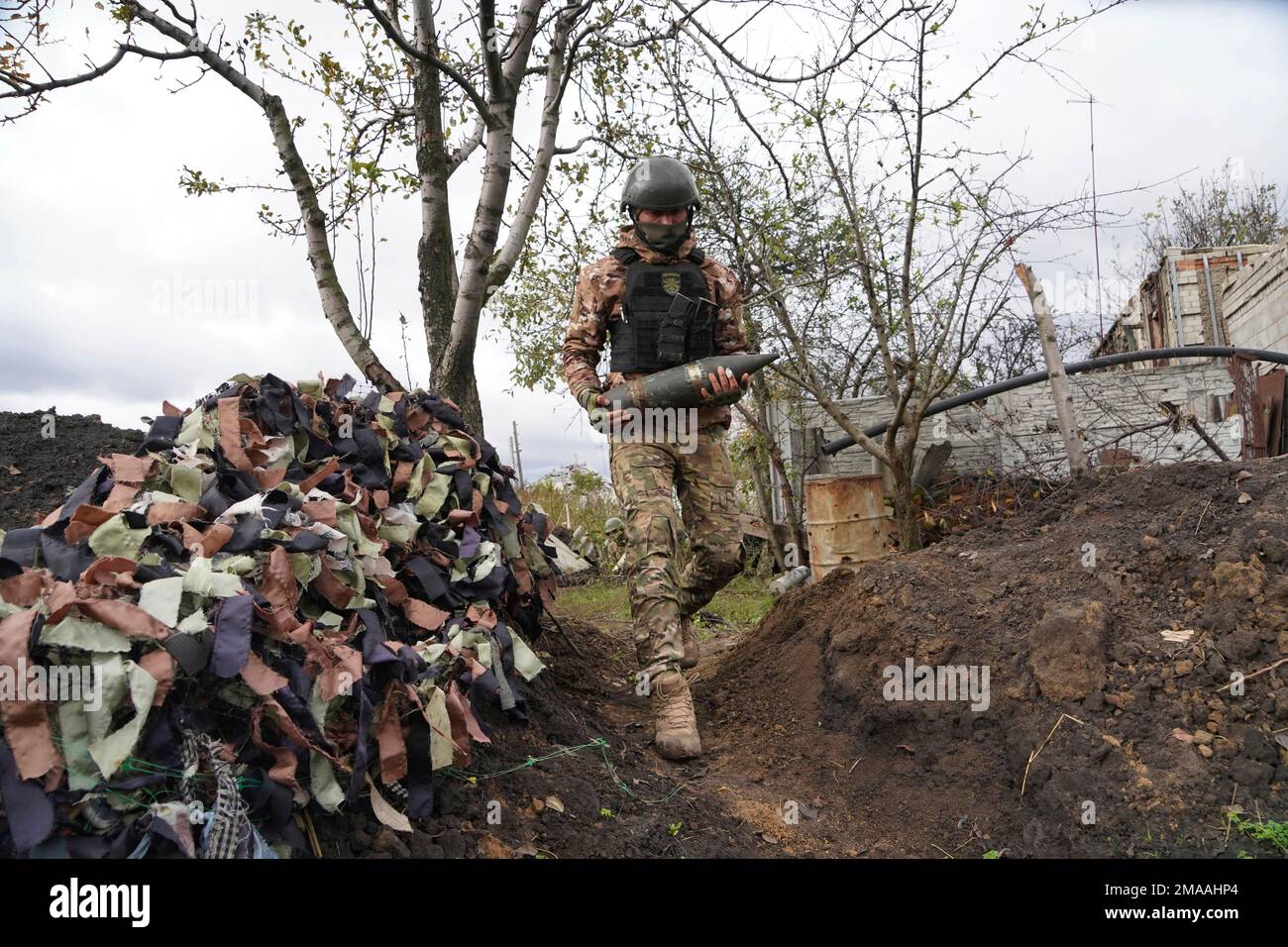 A Ukrainian soldier prepares to fire, on the front line in the Kharkiv ...