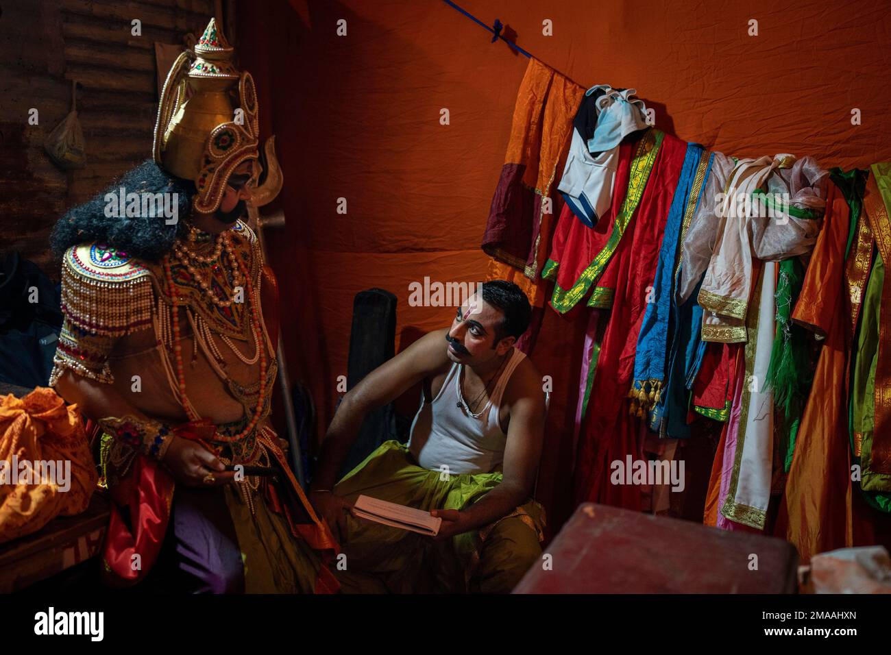 Artists practice their dialogue before performing a traditional ...