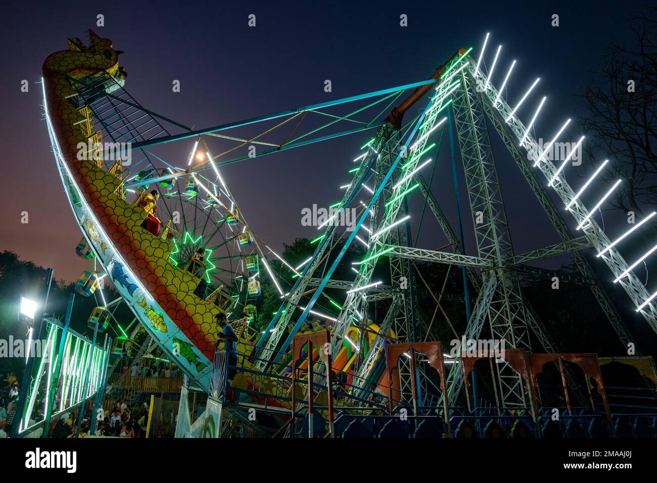 People go on a ride at a fair ground during Dusherra festival in New ...