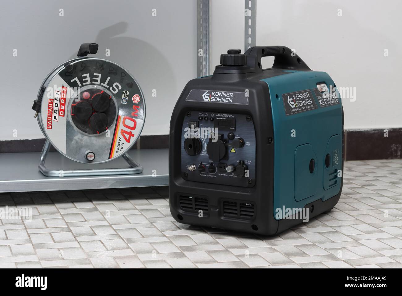 A portable gasoline powered generator with a cable drum Stock Photo - Alamy