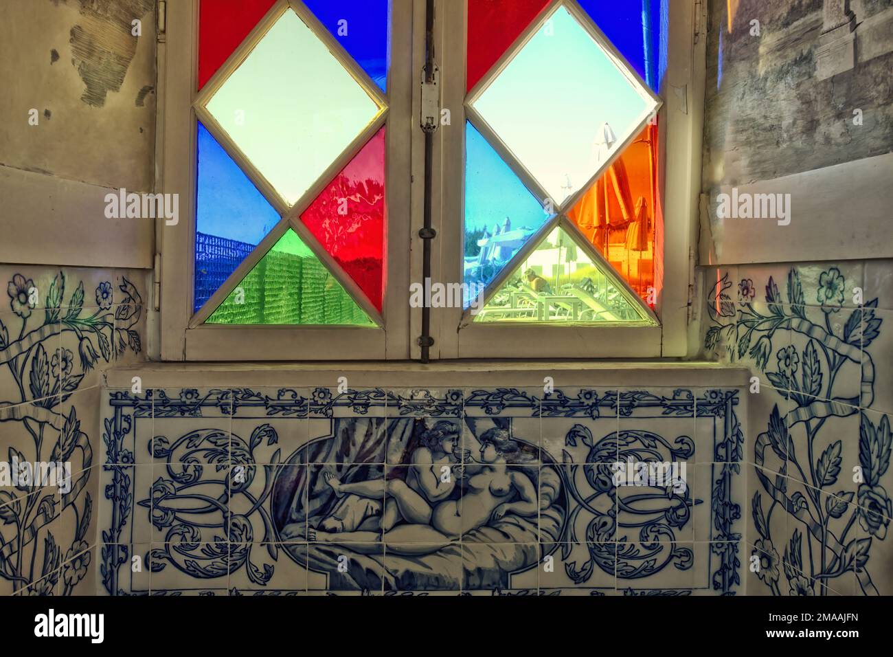 Stained glass window and azulejos tiles in a garden pavilion, Estoi ...