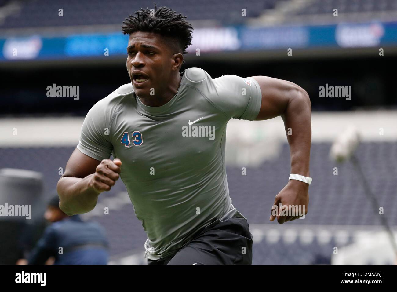 Defensive lineman Kenneth Odumegwu, of Nigeria, participates in a drill ...