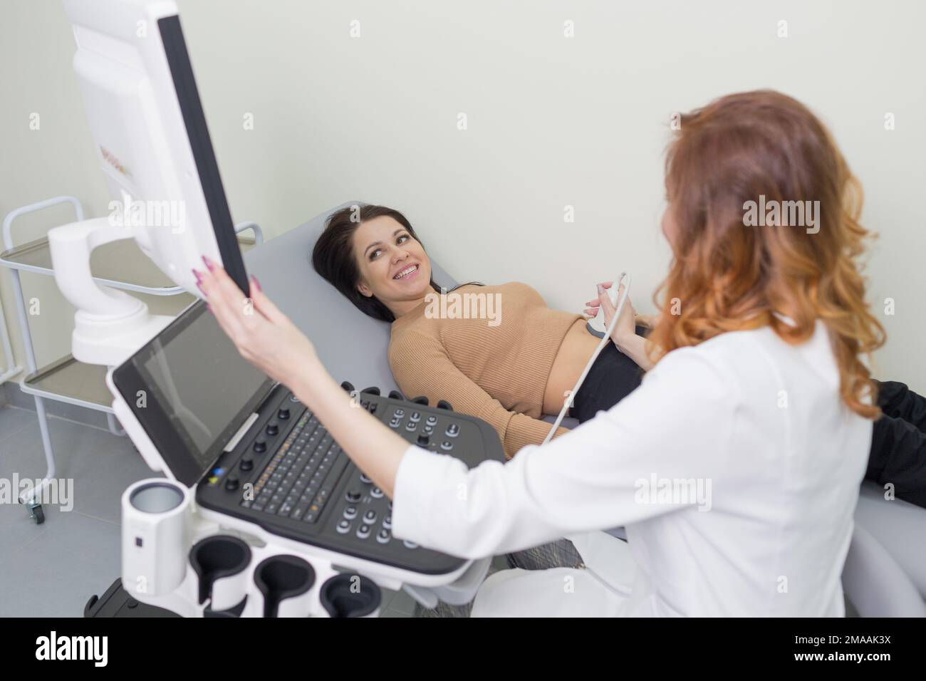 Female doctor performs abdominal hi-res stock photography and images ...