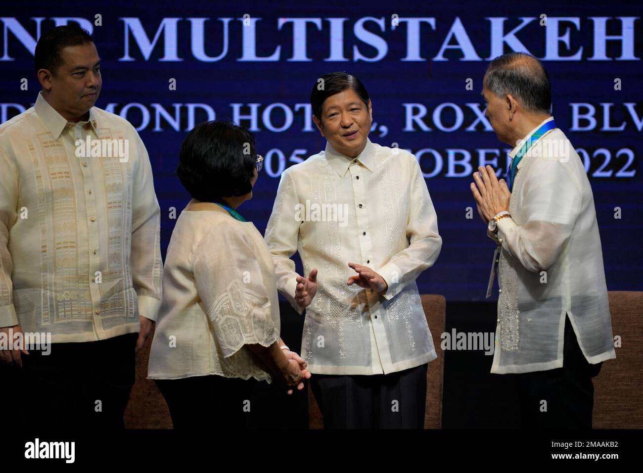 Philippine President Ferdinand Marcos Jr., second from right, talks at ...