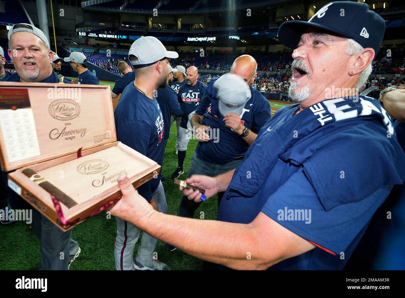 Atlanta Braves pitching coach Rick Kranitz hands out cigars after ...