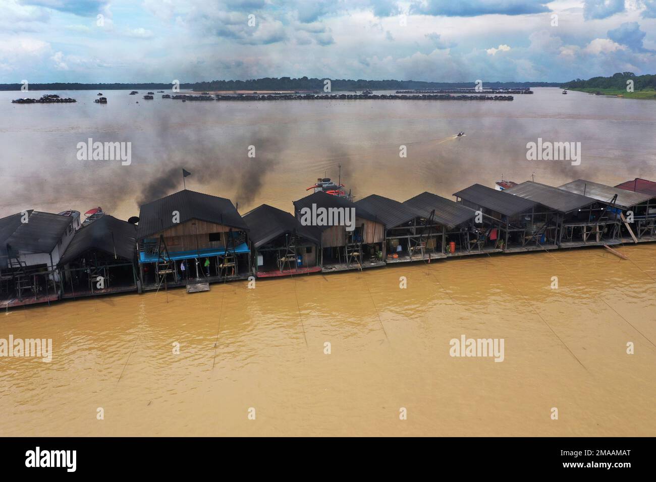 FILE - Dredging barges operated by miners illegally mining gold ...