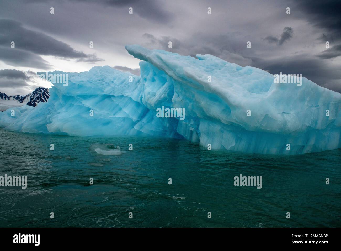 Nice blue icebers. Expedition cruise vessel Greg Mortimer in Svalbard ...