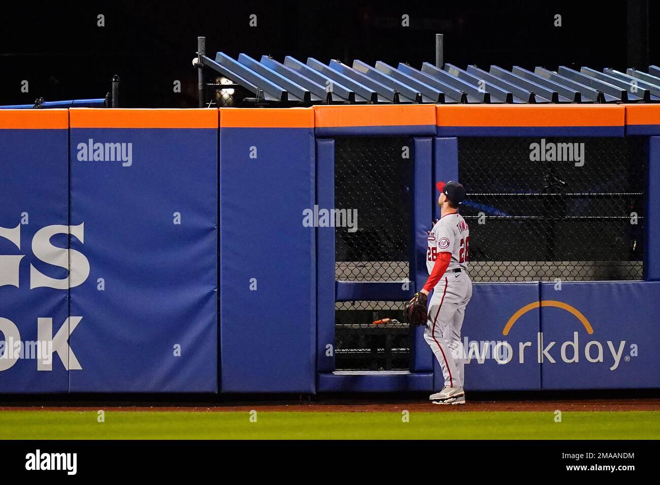 Washington Nationals' Lane Thomas (28) watches a home run by New York ...